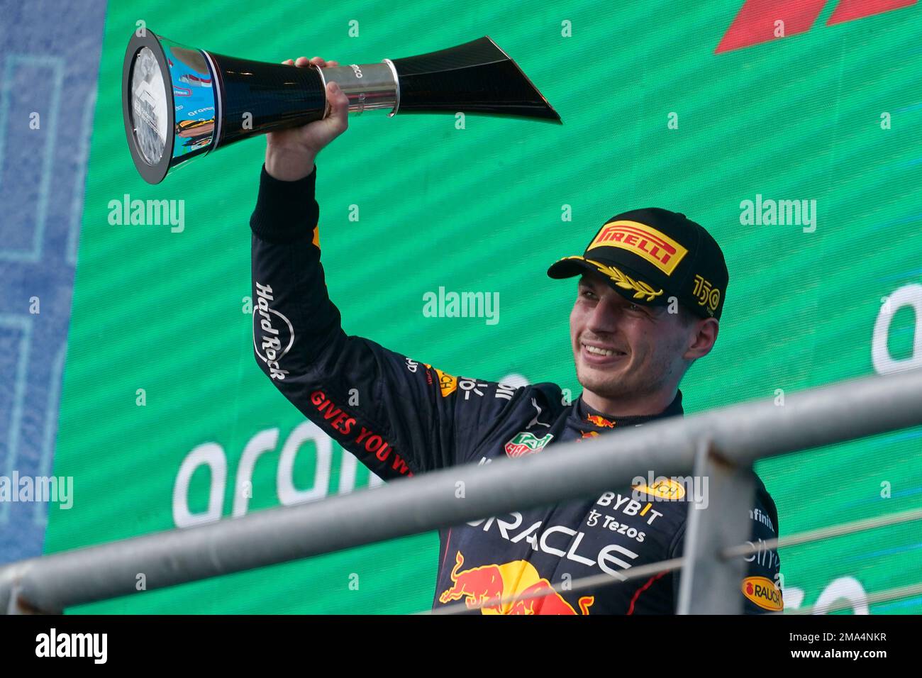 Red Bull driver Max Verstappen, of the Netherlands, raises the trophy ...