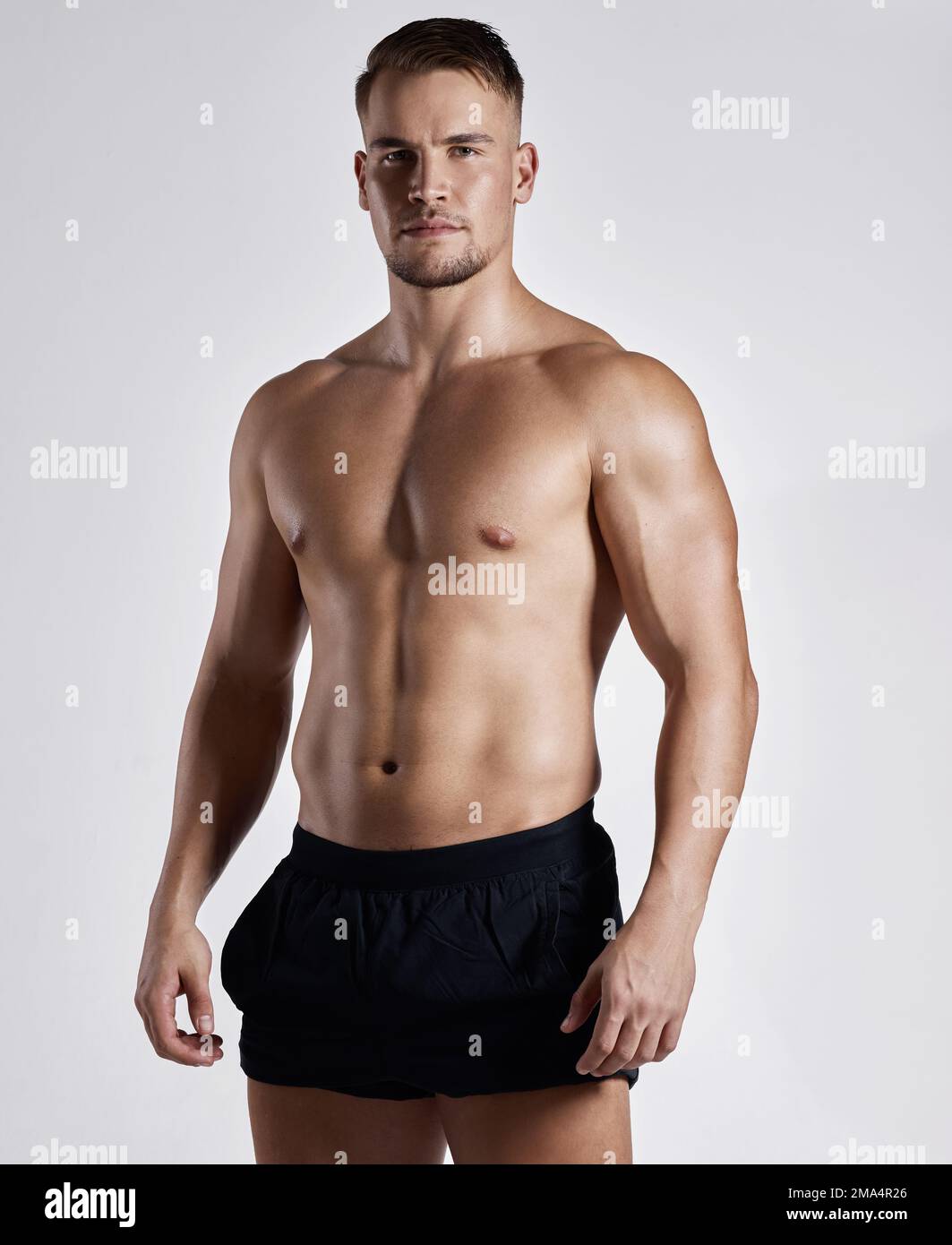Want to know what fit looks like. a muscular young man posing against a ...