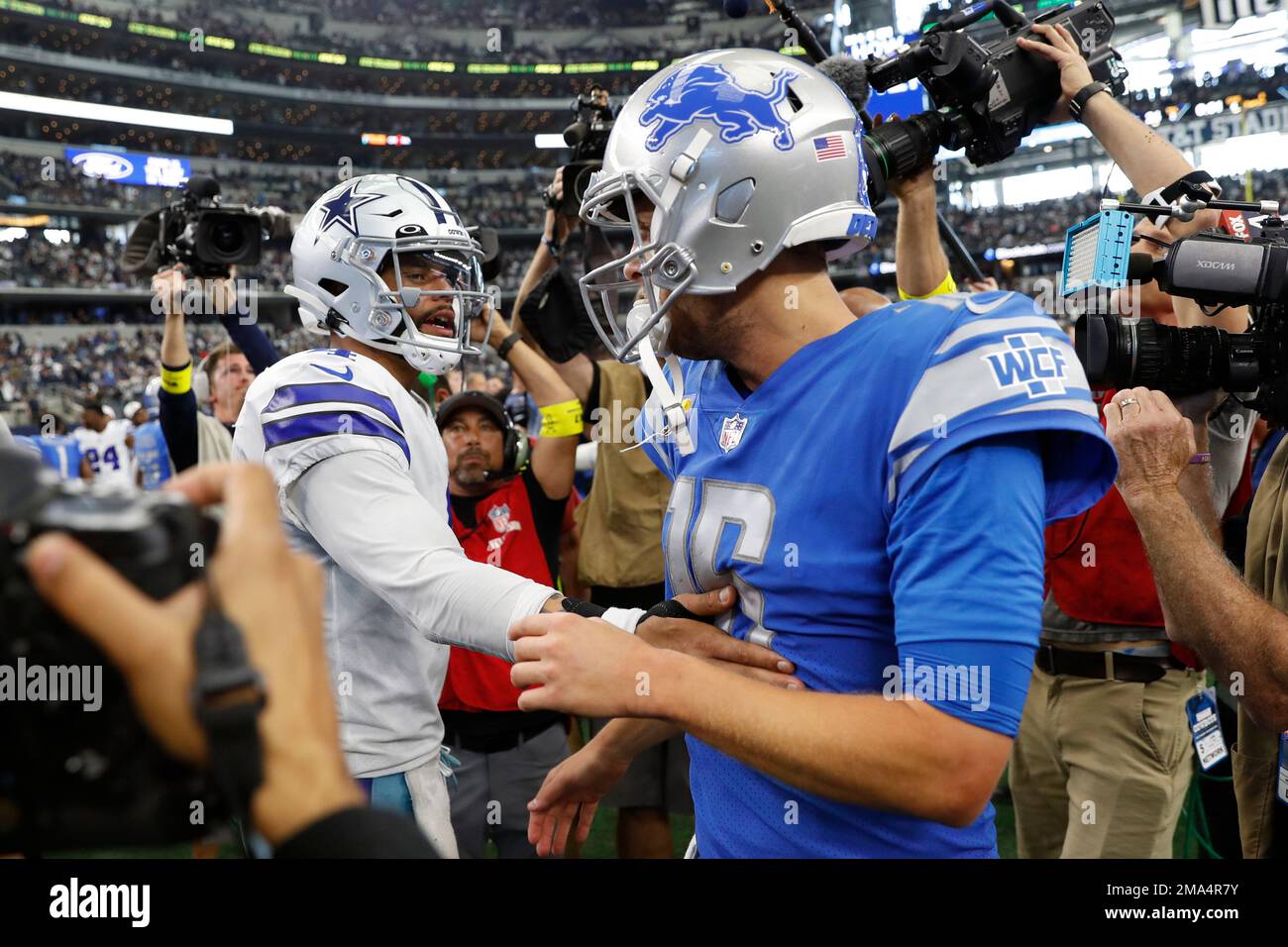 Dallas Cowboys quarterback Dak Prescott, left, greets Detroit Lions ...