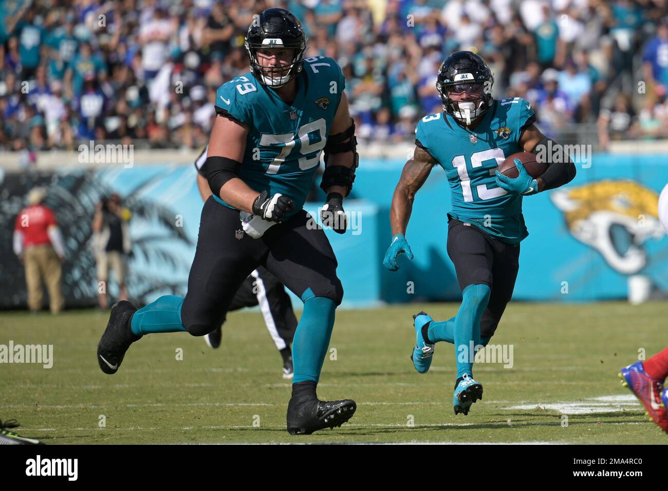 Jacksonville Jaguars wide receiver Christian Kirk (13) follows a block ...