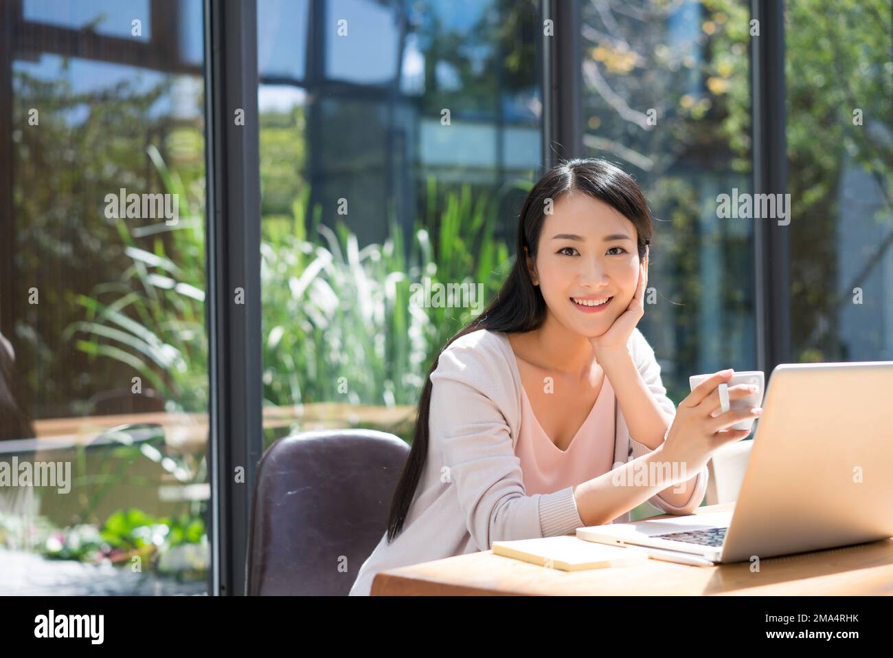 A young woman use the computer Stock Photo - Alamy
