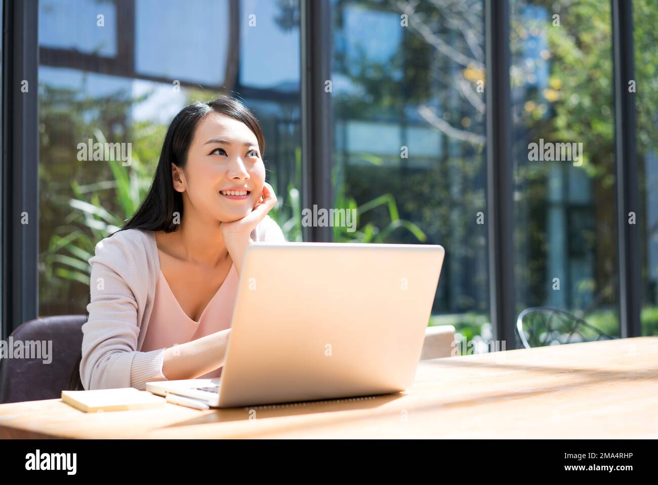 A young woman use the computer Stock Photo - Alamy