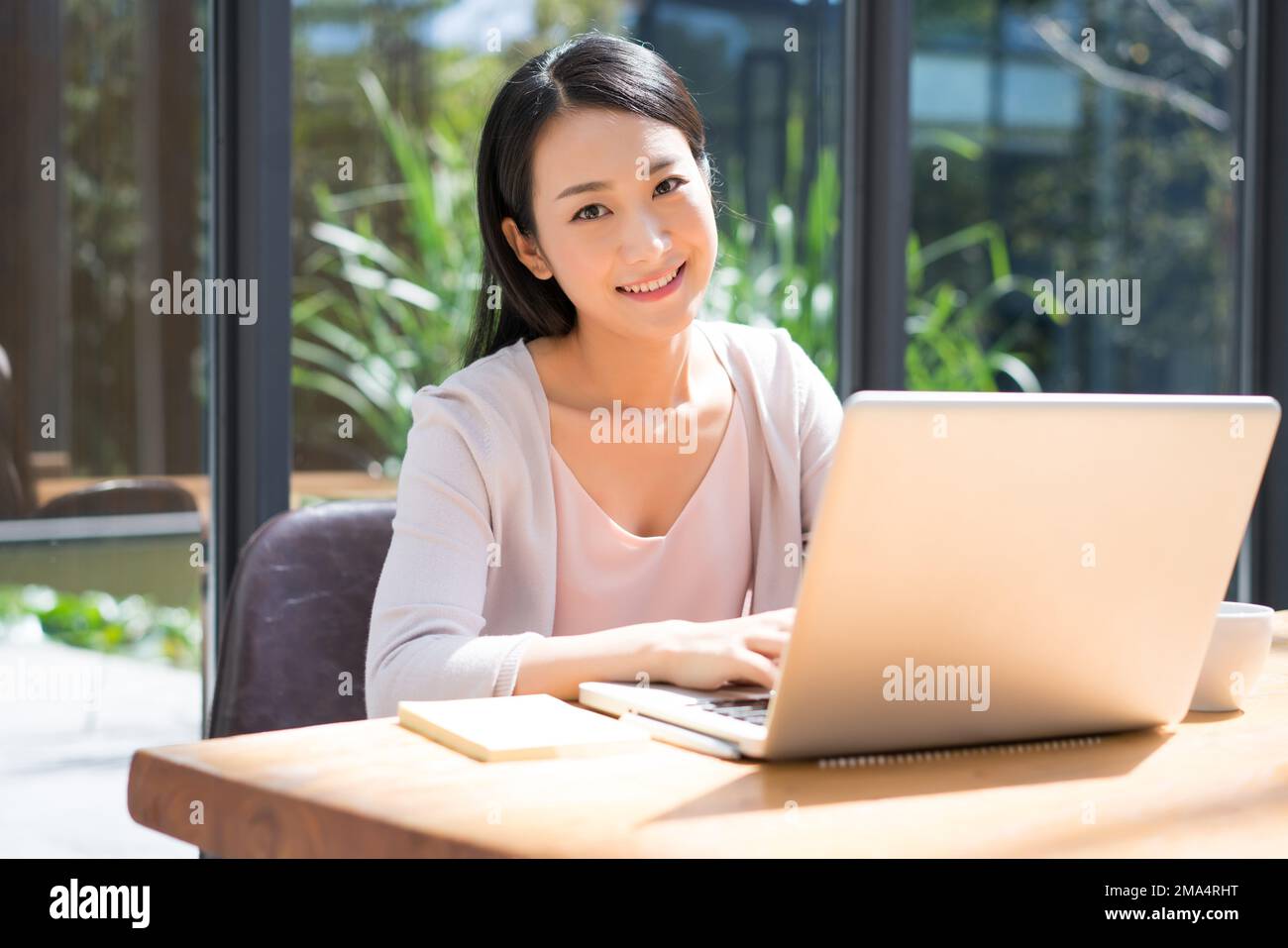 A young woman use the computer Stock Photo - Alamy