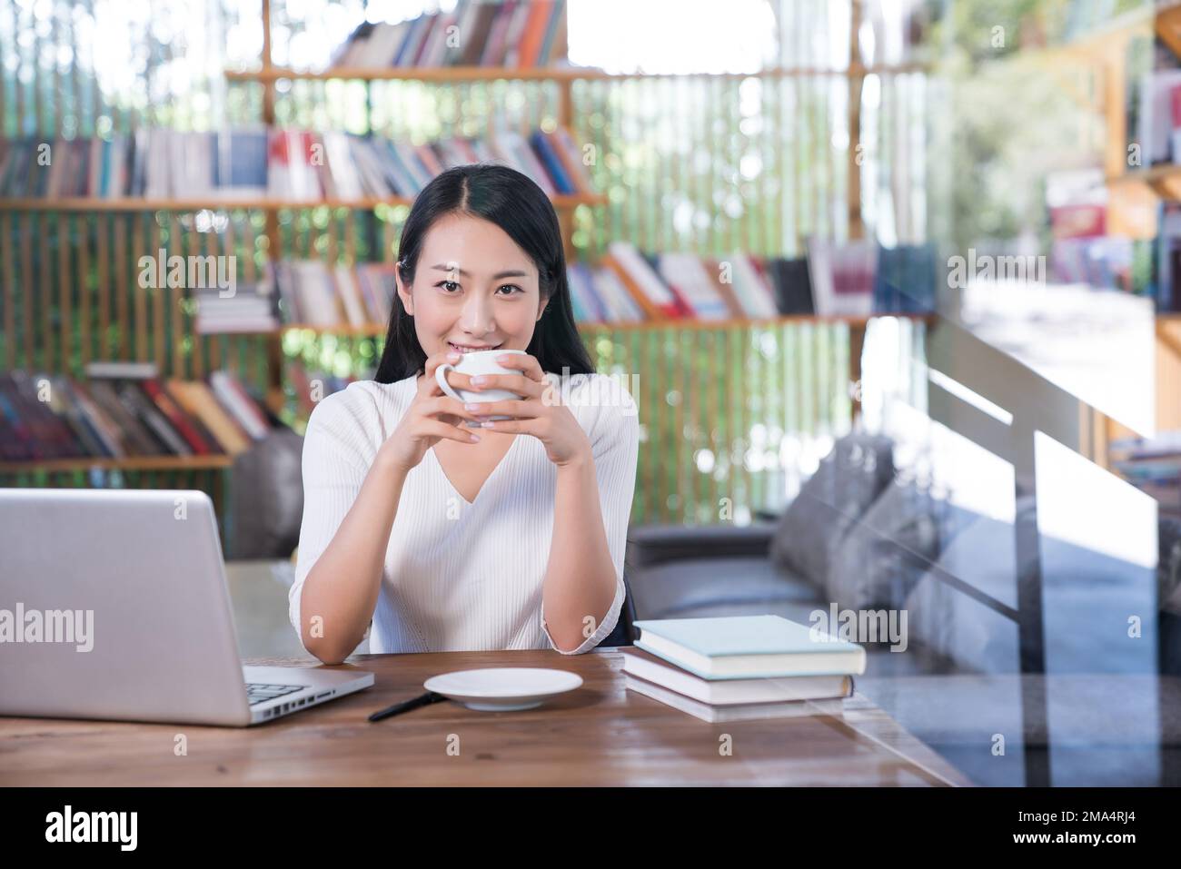 A young woman use the computer Stock Photo - Alamy