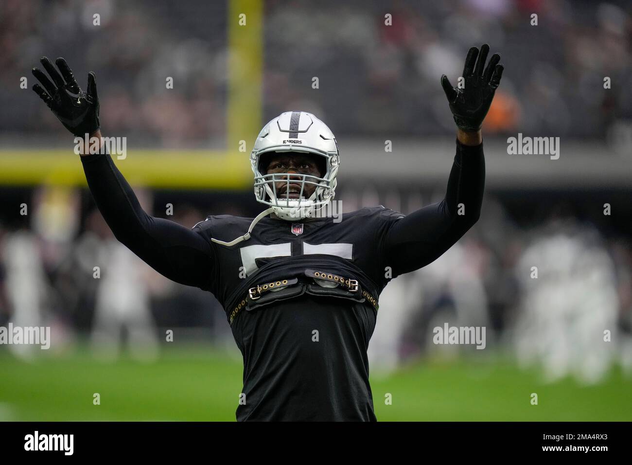 Las Vegas Raiders defensive end Chandler Jones warms up before an NFL ...