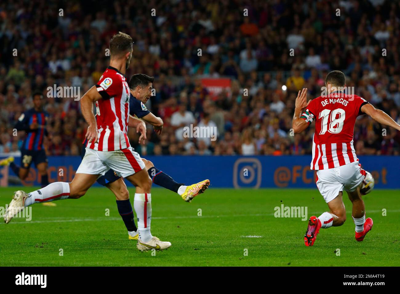 Barcelona's Robert Lewandowski, centre, scores his side's third goal during a Spanish La Liga ...