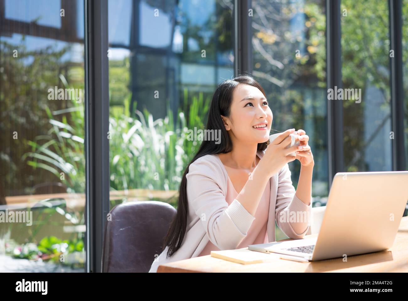 A young woman use the computer Stock Photo - Alamy
