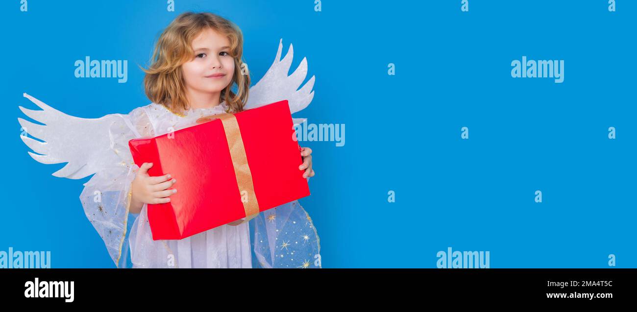 Kid boy angel with gift box present. Valentine's day. Blonde cute child ...