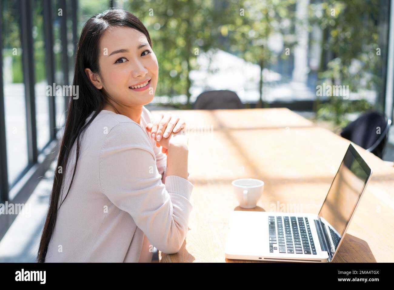 A young woman use the computer Stock Photo - Alamy