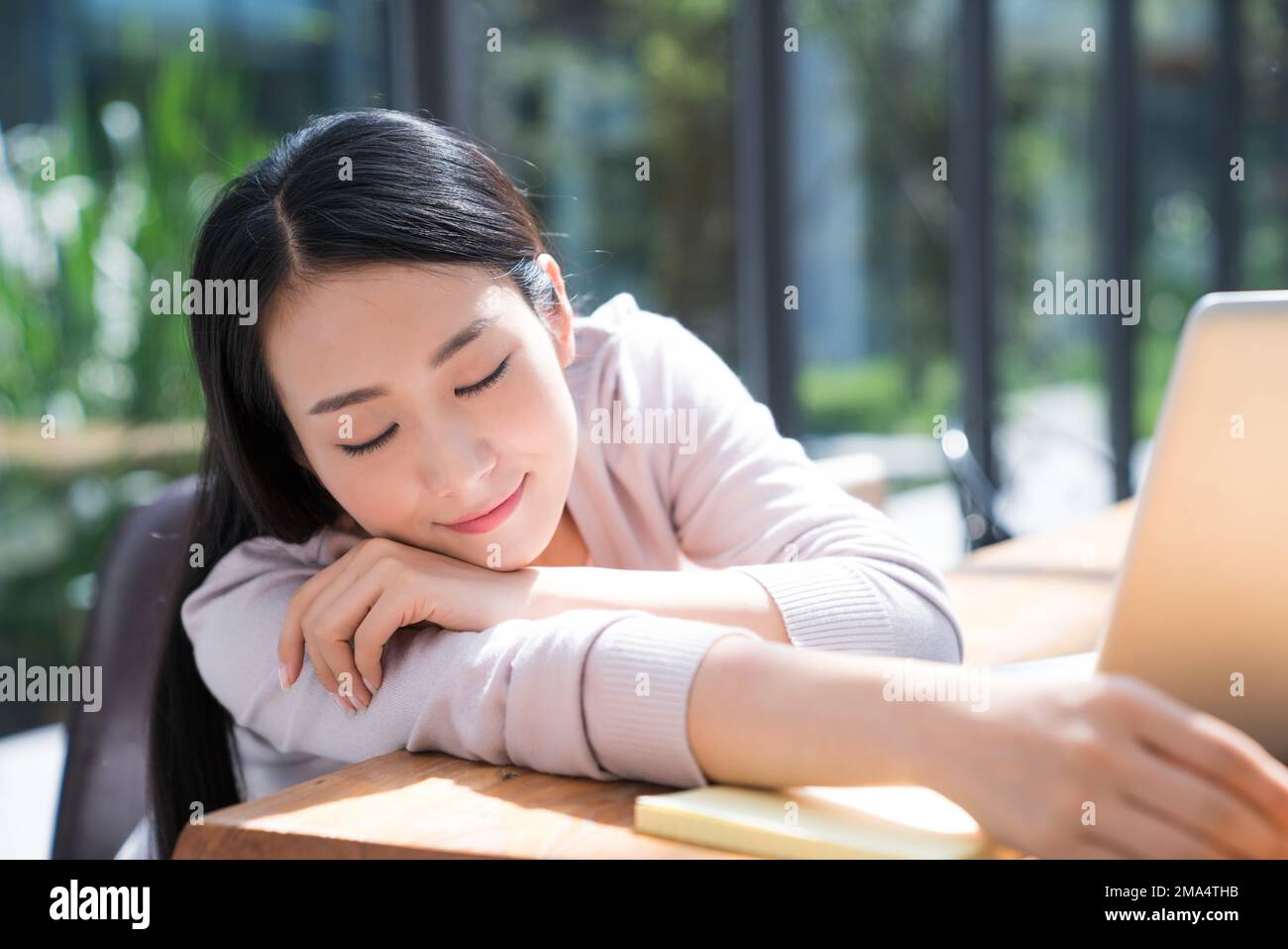 A young woman use the computer Stock Photo - Alamy