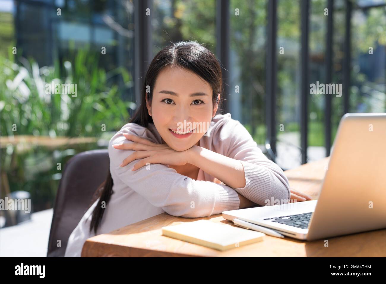 A young woman use the computer Stock Photo - Alamy