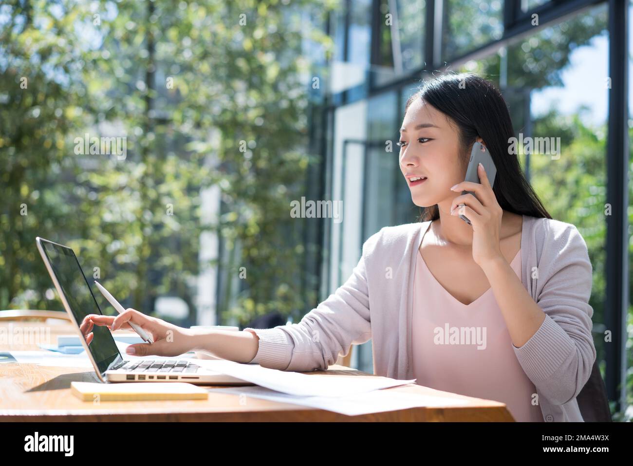 A young woman use the computer Stock Photo - Alamy