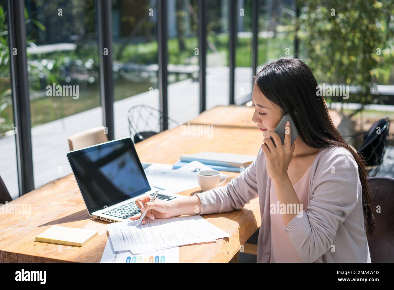 A young woman use the computer Stock Photo - Alamy