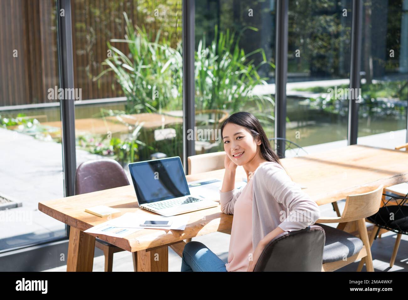 A young woman use the computer Stock Photo - Alamy