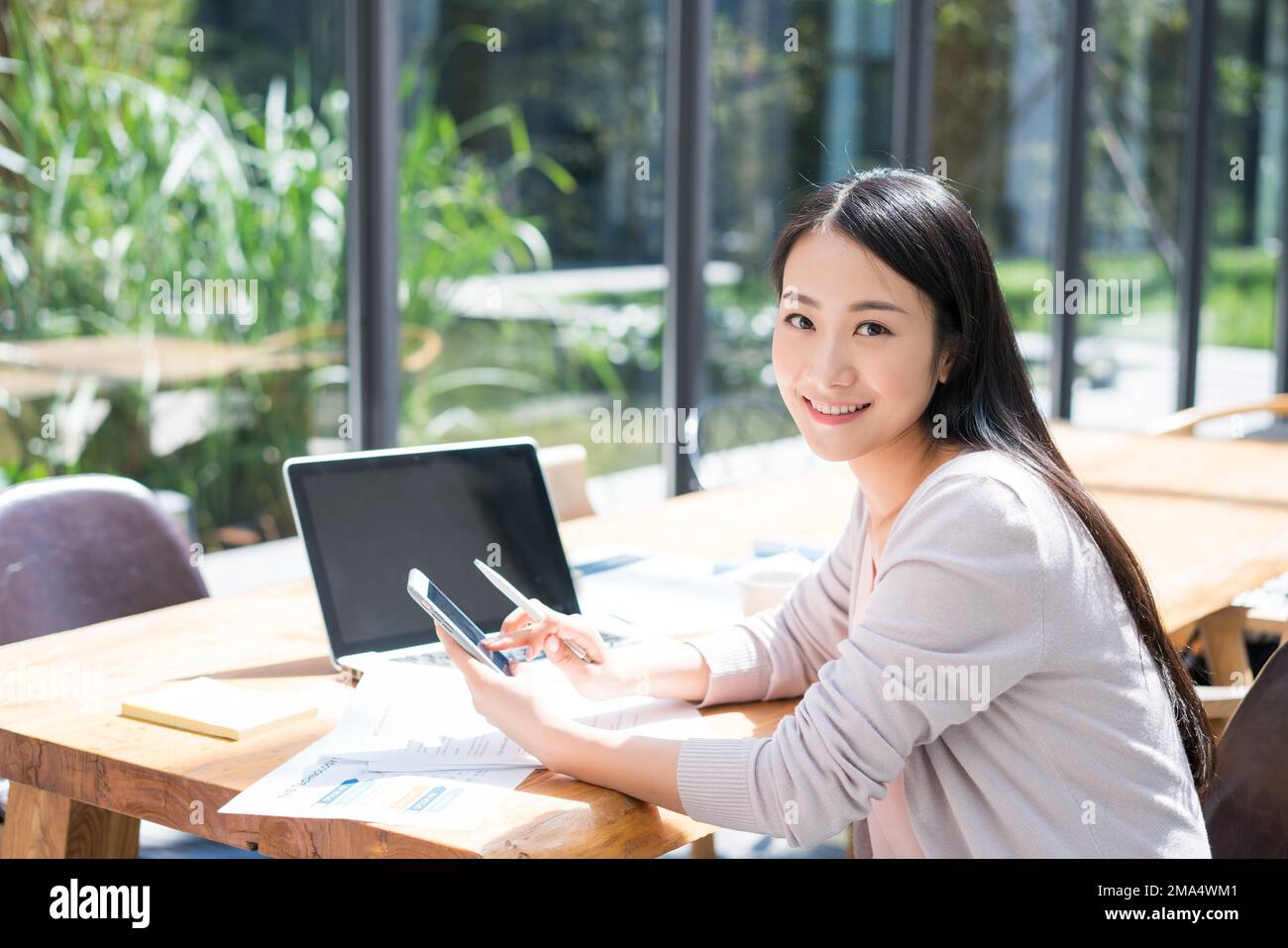 A young woman use the computer Stock Photo - Alamy