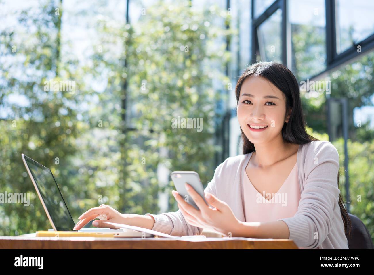 A young woman use the computer Stock Photo - Alamy