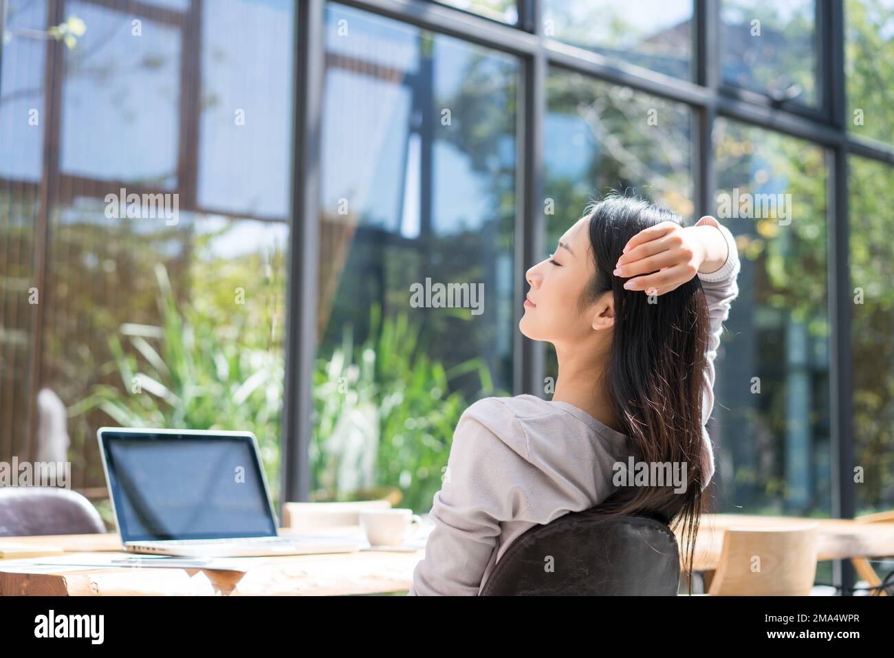 A young woman use the computer Stock Photo - Alamy