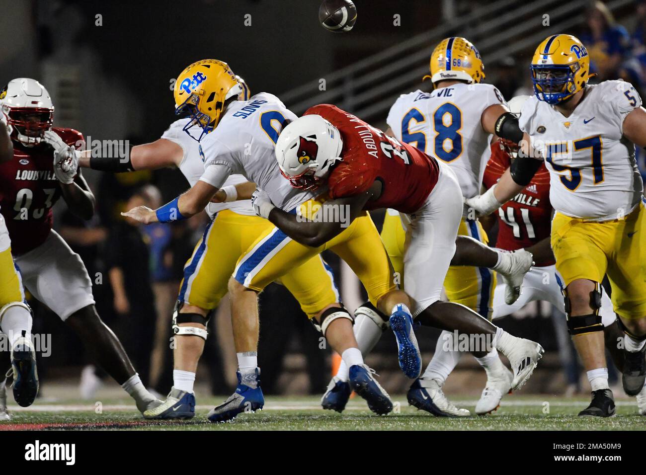 Louisville linebacker Yasir Abdullah (22) hits Pittsburgh quarterback ...