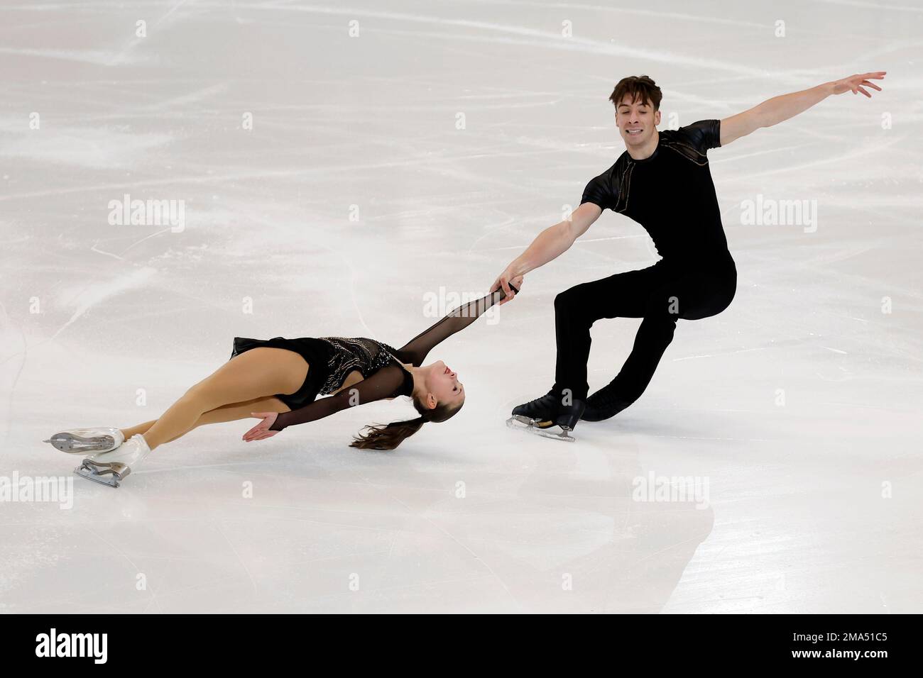 Kelly Ann Laurin and Loucas Ethier perform in the pairs short program ...