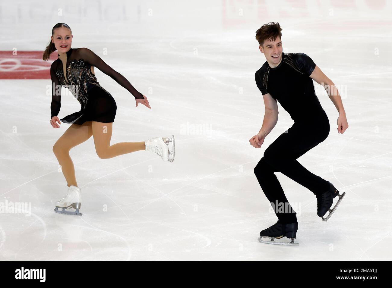 Kelly Ann Laurin and Loucas Ethier perform in the pairs short program ...