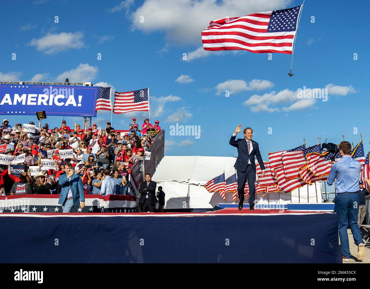 Texas Attorney General Ken Paxton waves to the crowd during a rally ...