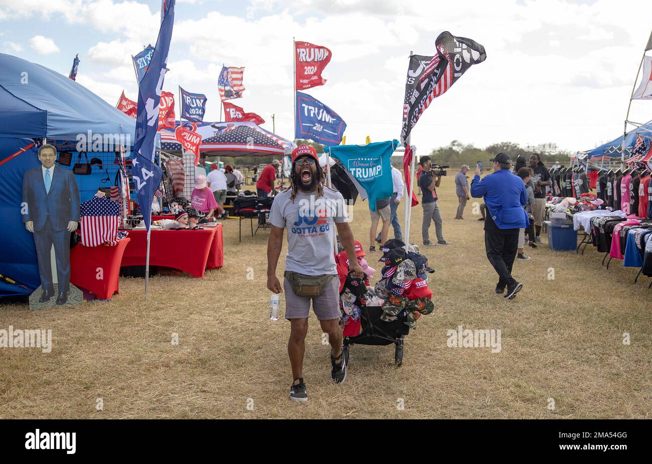 Adrian Robinson of St. Louis sells hats, shirts and flags before the ...