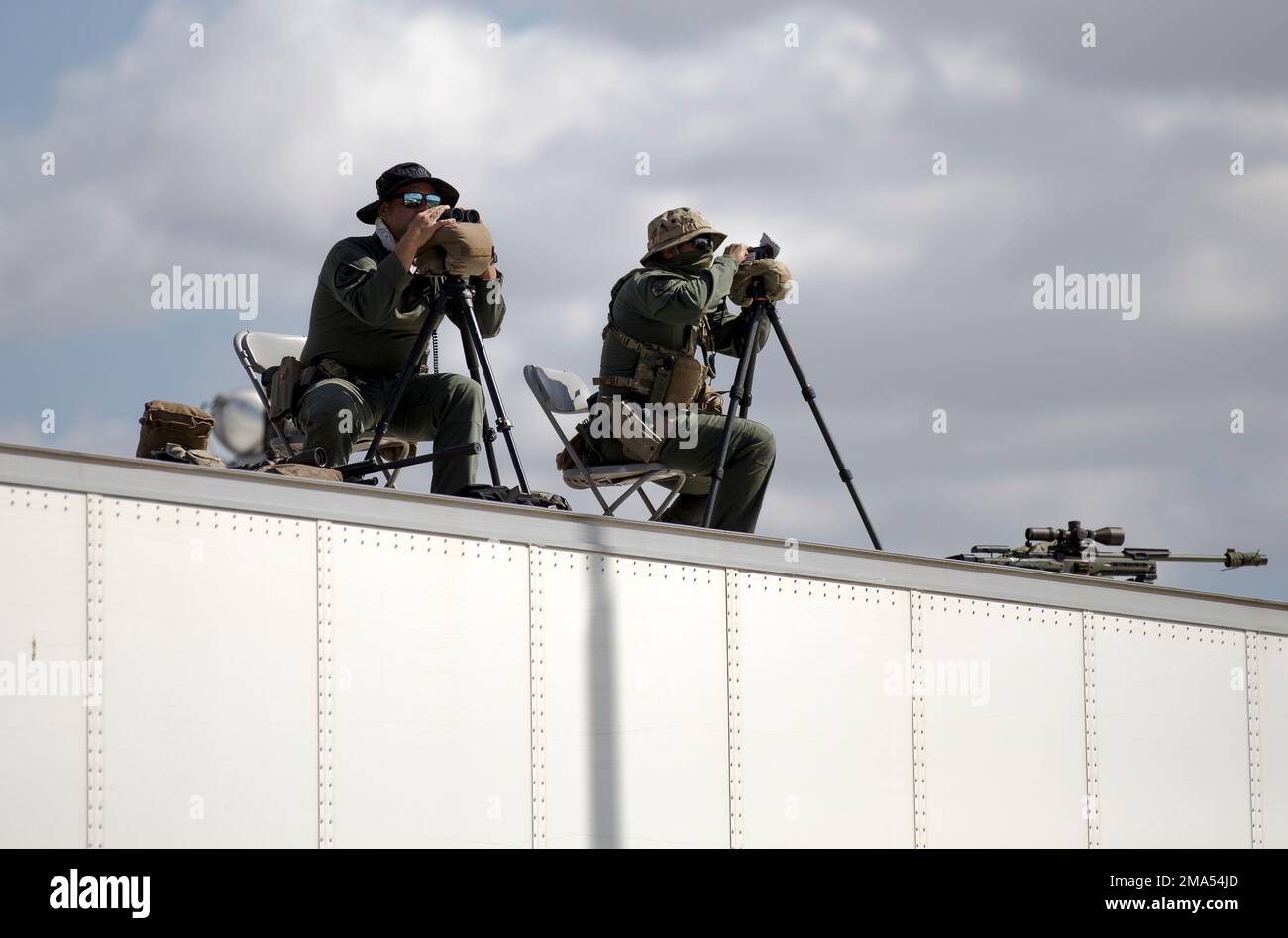 Members of a Corpus Christi Police Department sniper team scan the ...