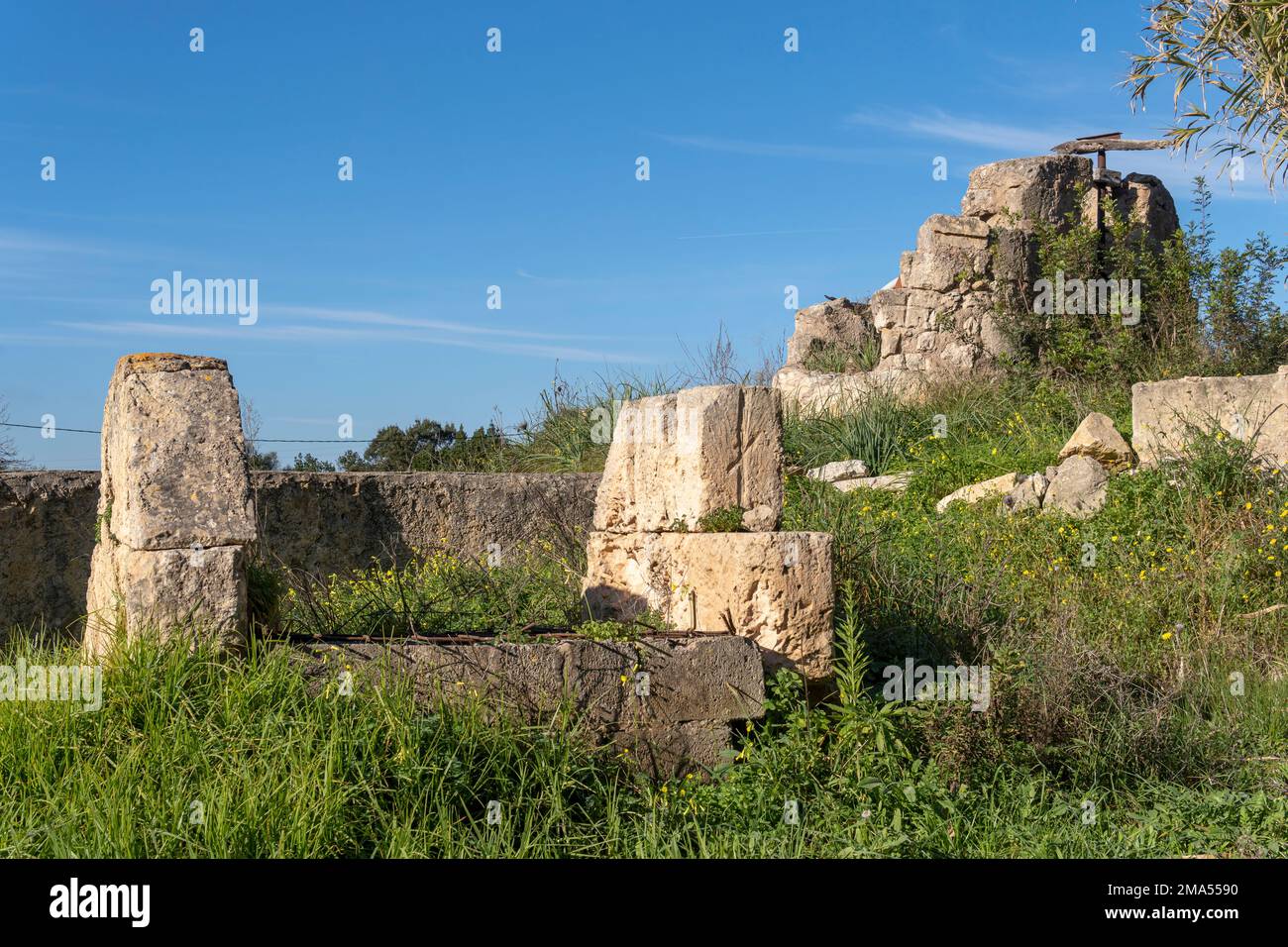 Old stone irrigation ditch and a well in disuse and in a ruinous state ...