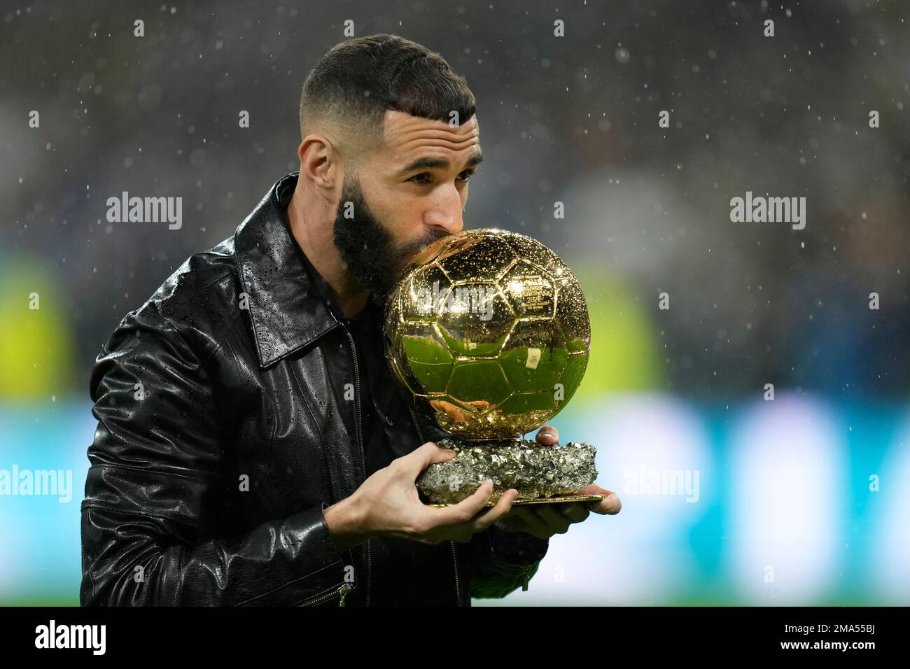 Real Madrid's Karim Benzema kisses the 2022 Ballon d'Or trophy prior to ...