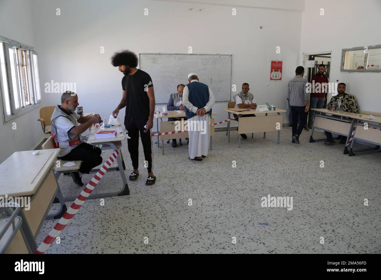 A man takes part in municipal elections in the city of Tarhuna, Libya ...