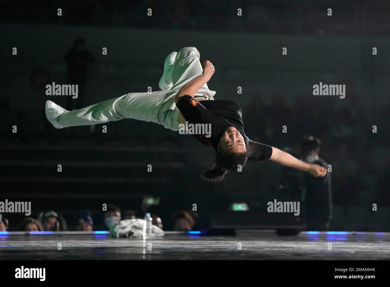 Liu Qingyi of China, known as B-girl 671, competes against Ami Yuasa of ...