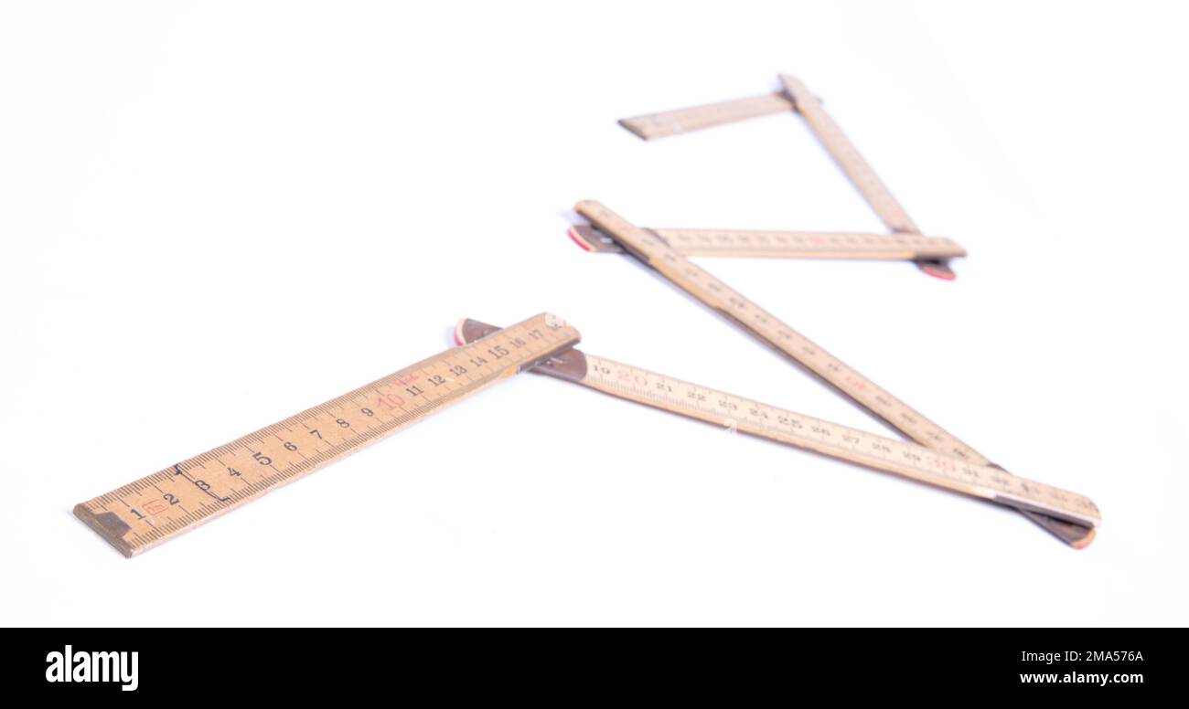 Old folding wooden ruler, isolated on white Stock Photo - Alamy