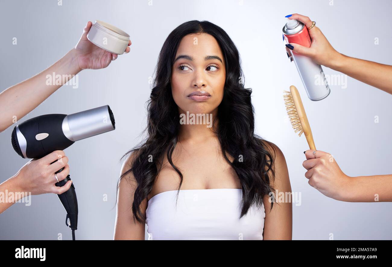 The things we go through to look good. an attractive young woman ...