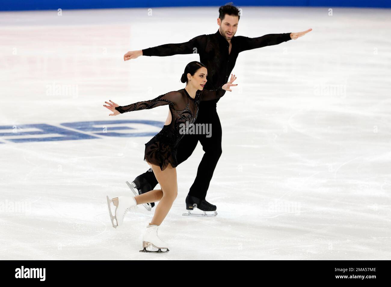 Deanna Stellato-Dudek and Maxime Deschamps perform in the pairs short ...