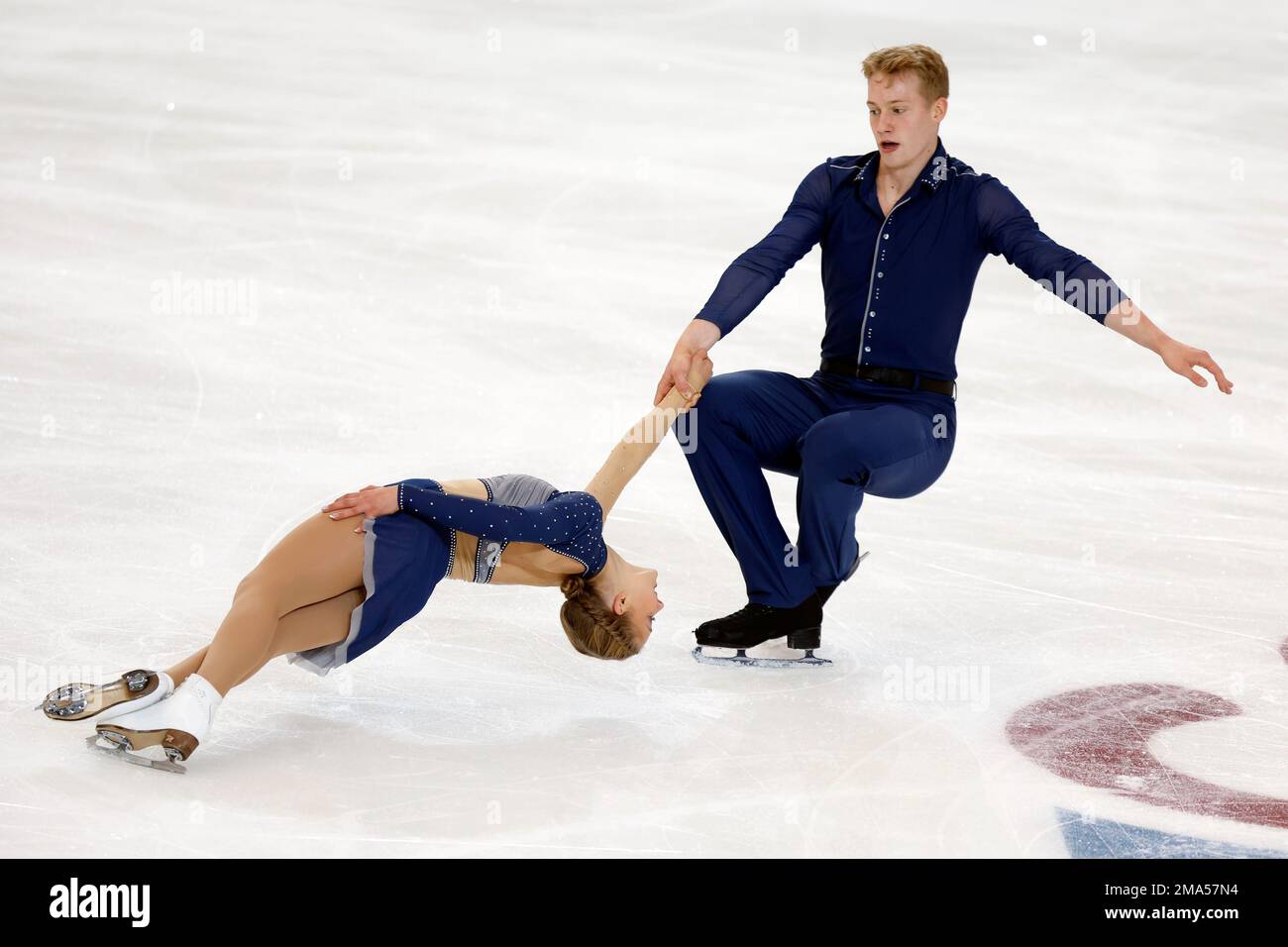 Letizia Roscher and Luis Schuster perform in the pairs short program ...