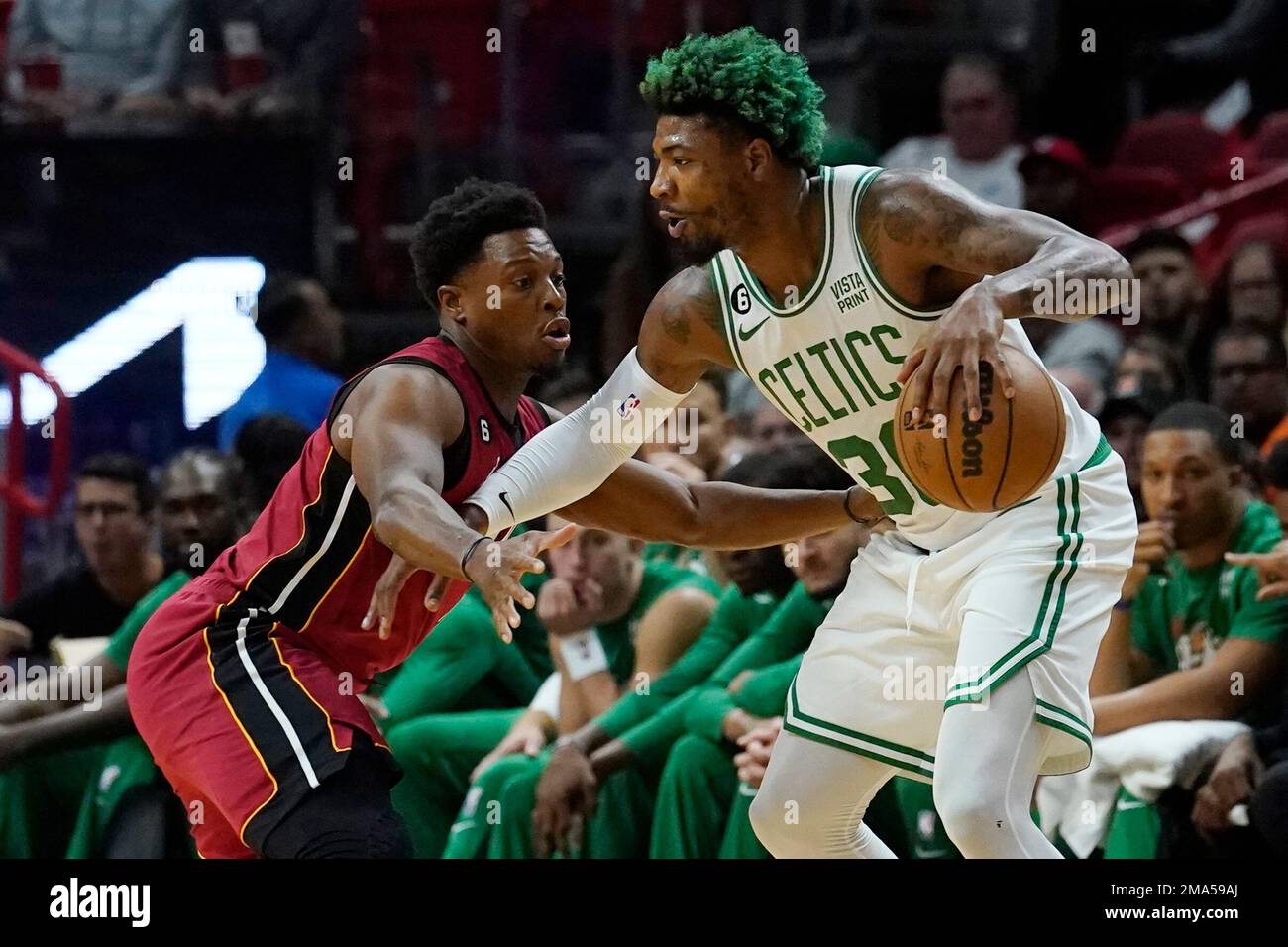 Miami Heat guard Kyle Lowry (7) defends Boston Celtics guard Marcus ...