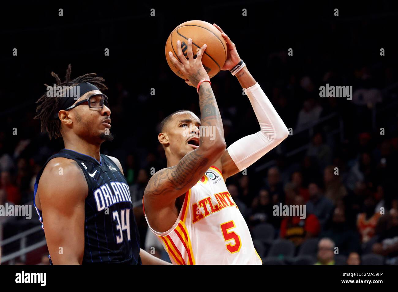 Atlanta Hawks guard Dejounte Murray (5) shoots next to Orlando Magic ...