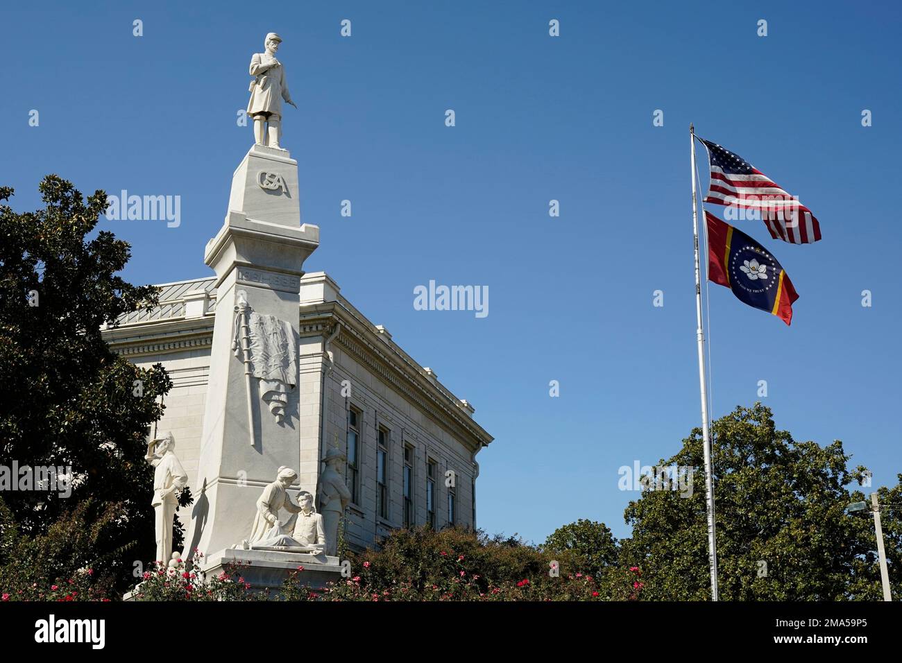A monument honoring the men and women of the Confederacy sits on one ...