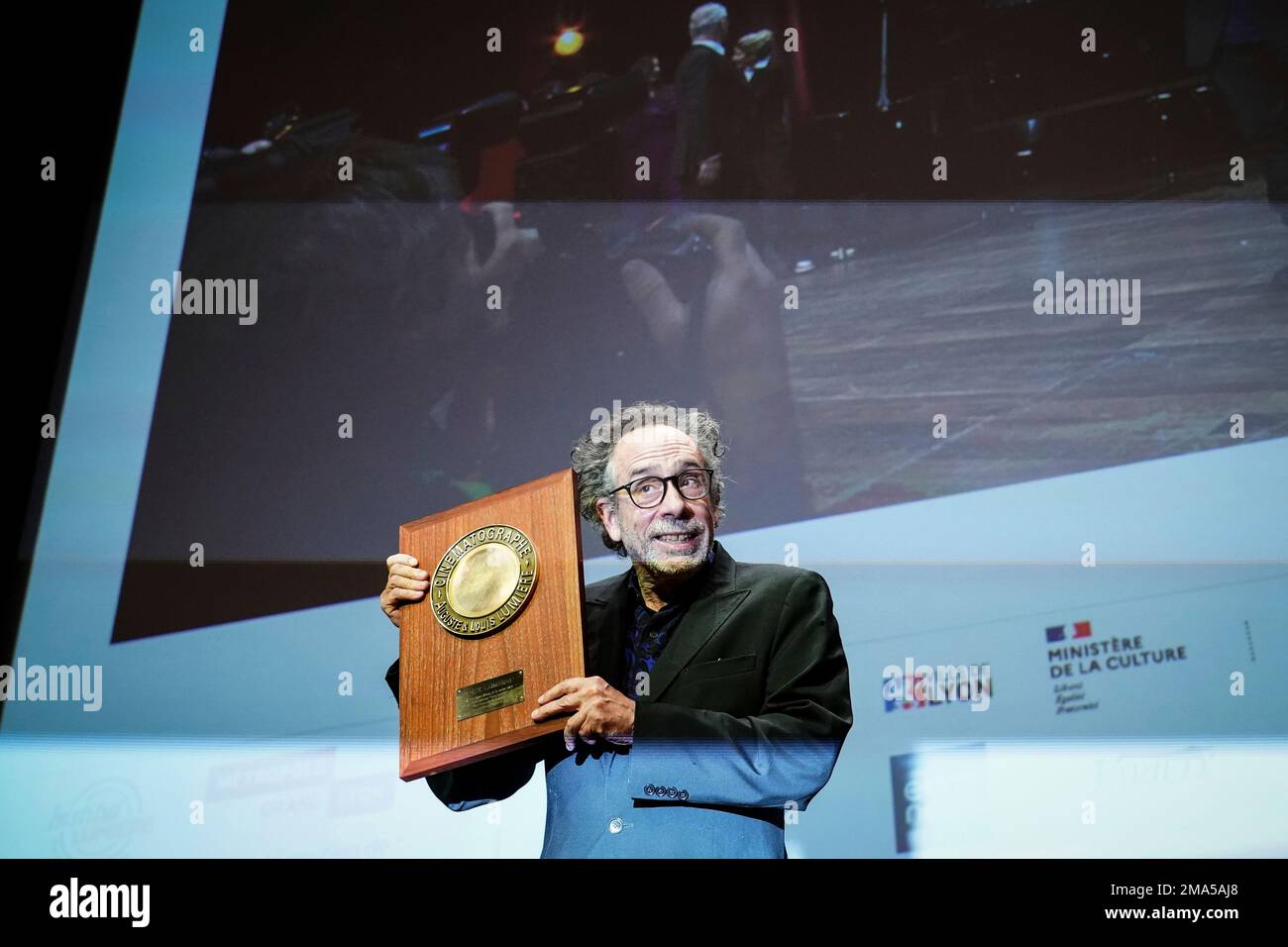 US Director Tim Burton holds his award during the Lumiere Award ...