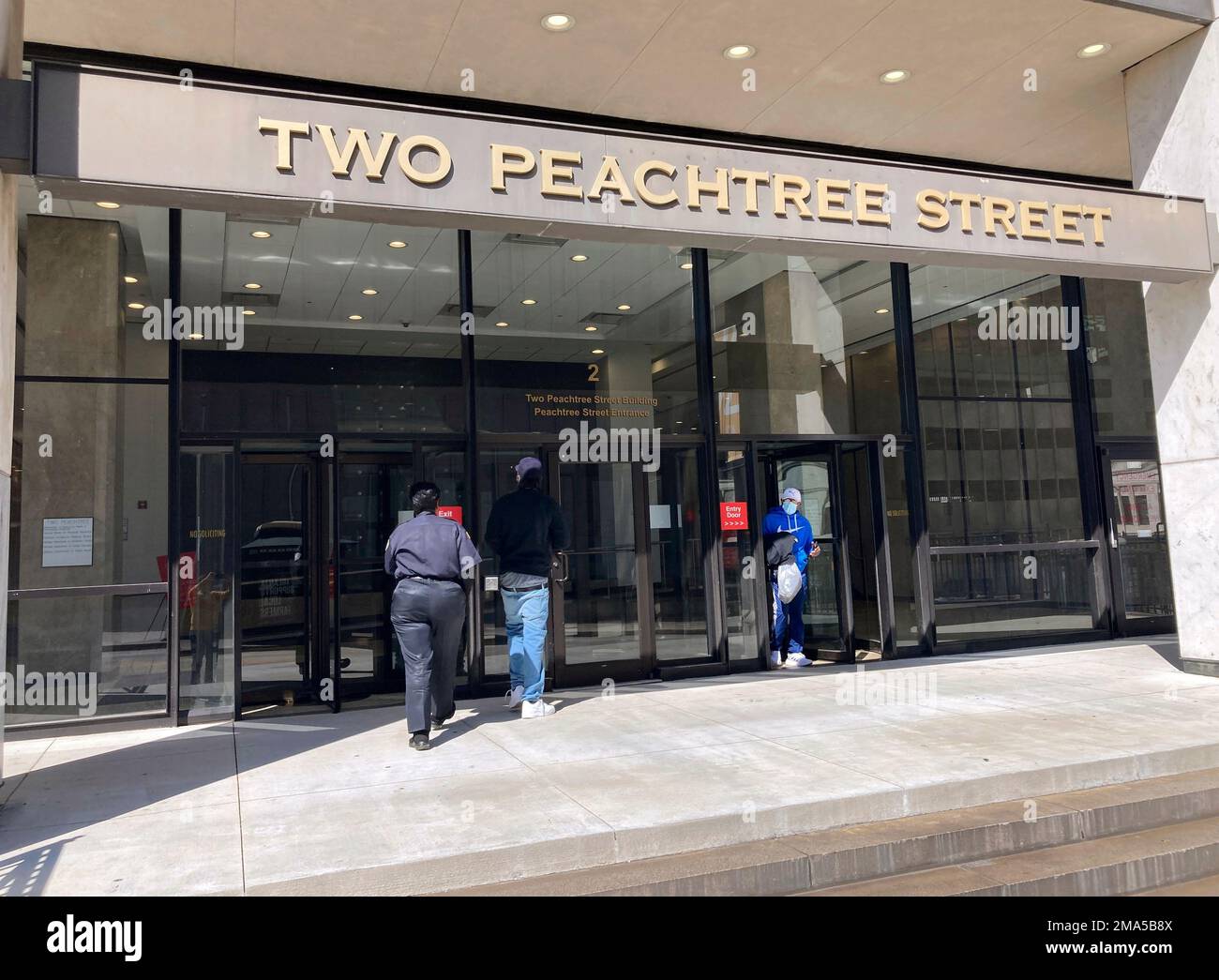 People enter the Two Peachtree Building on Friday, Oct. 21, 2022 in ...