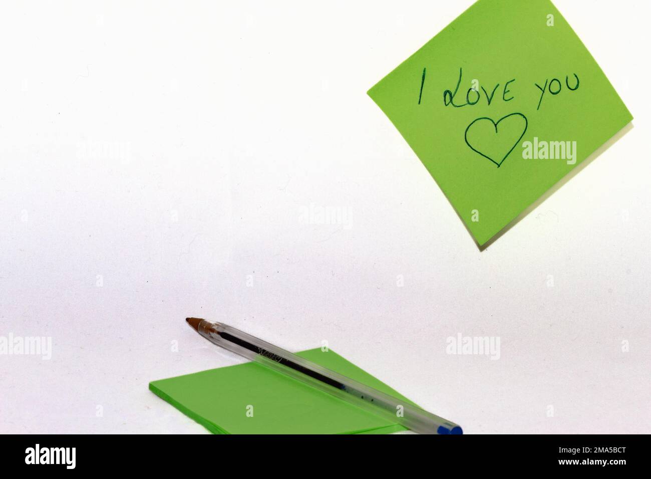 Note in which I love you is written by a lover on a small green sheet ...