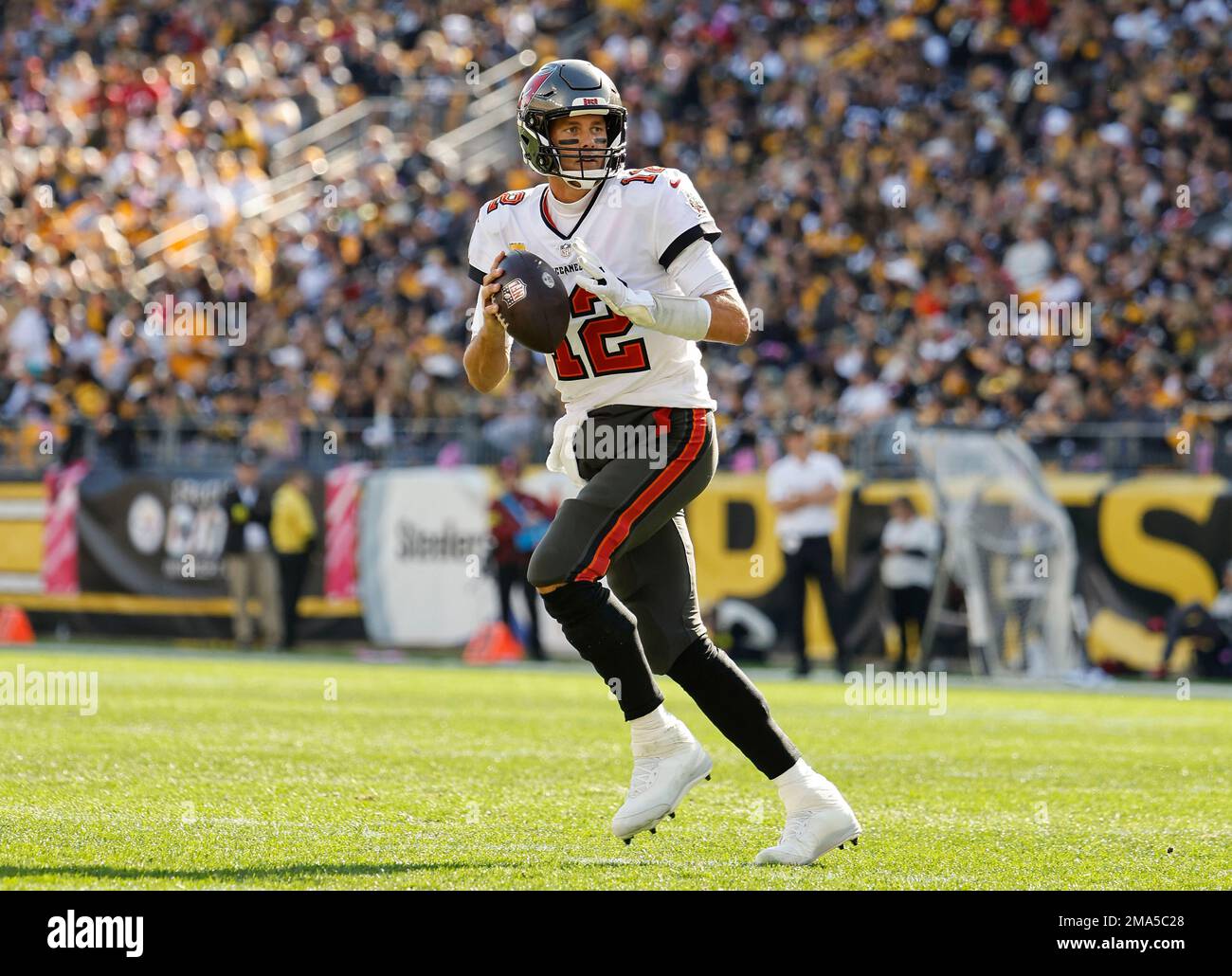 Tampa Bay Buccaneers quarterback Tom Brady rolls out during an NFL ...