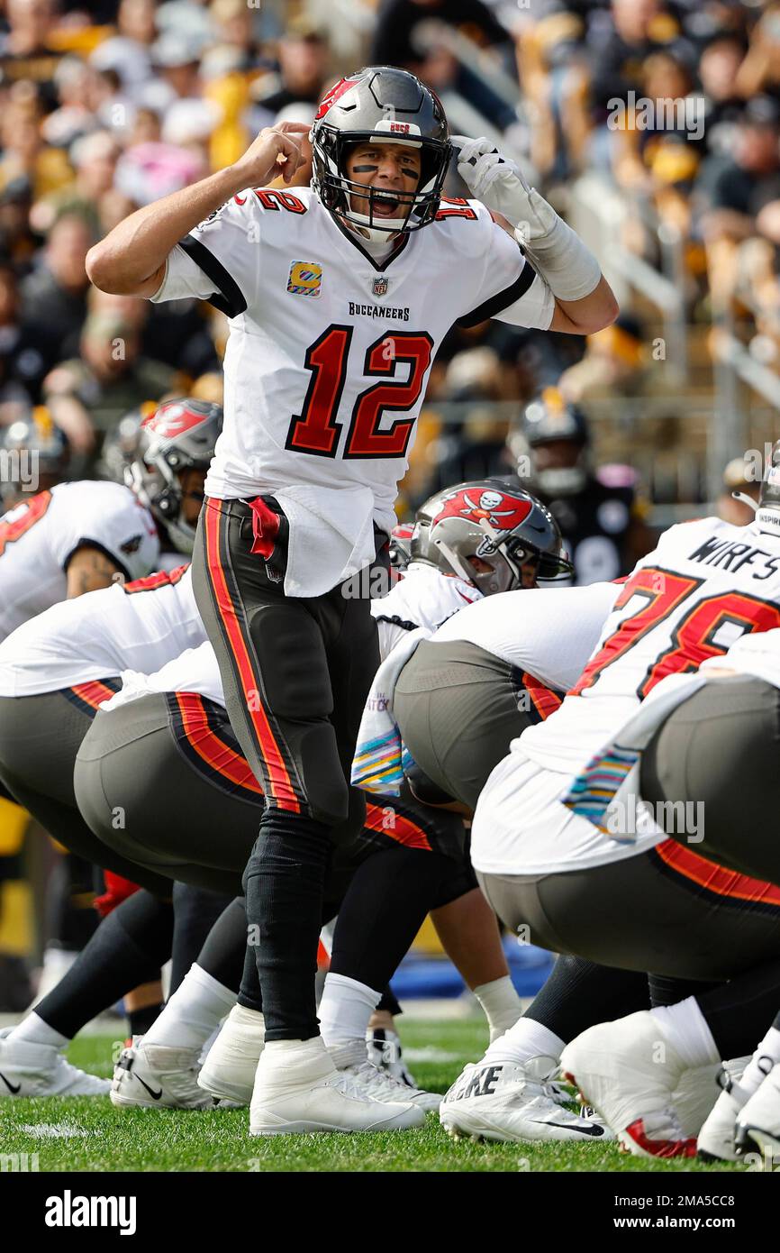 Tampa Bay Buccaneers quarterback Tom Brady class signals at the line of ...