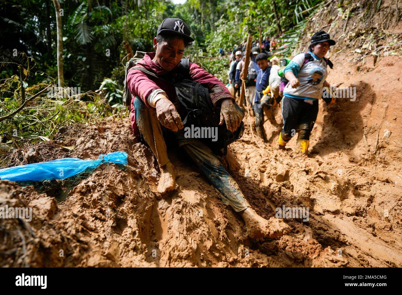 A Venezuelan migrant rests during the walk across the Darien Gap from ...