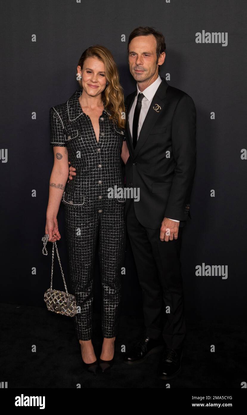 Sosie Bacon, left and Scott McNairy arrive at the Chanel dinner to ...