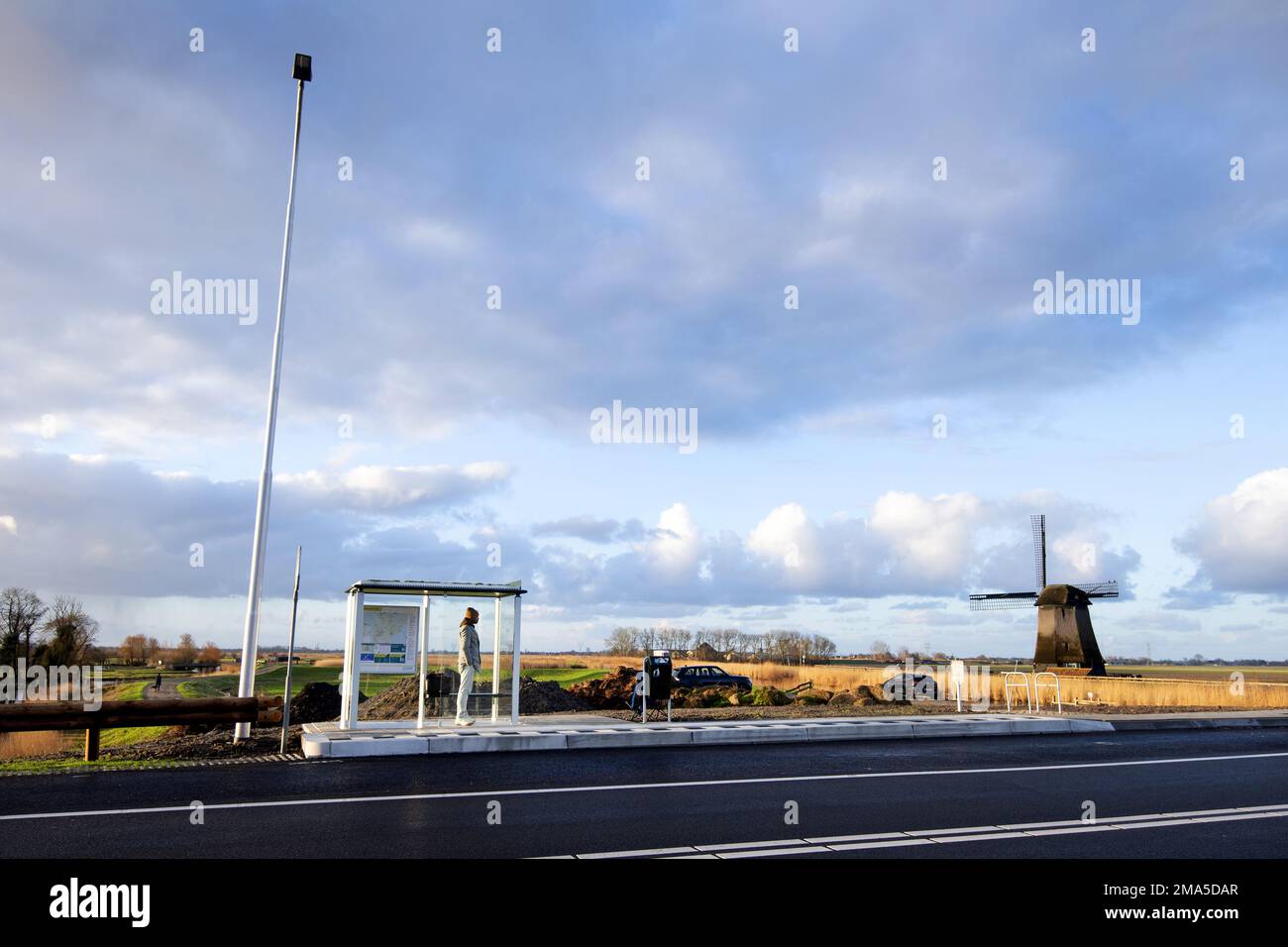 SCHERMERHORN - A man is waiting for the bus that never came. Thousands ...