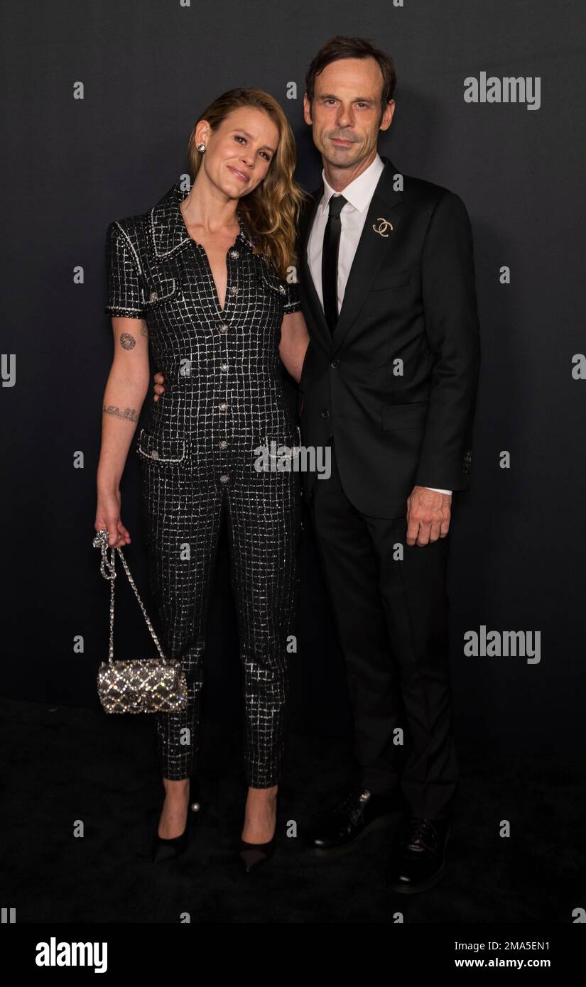 Sosie Bacon, left and Scott McNairy arrive at the Chanel dinner to ...