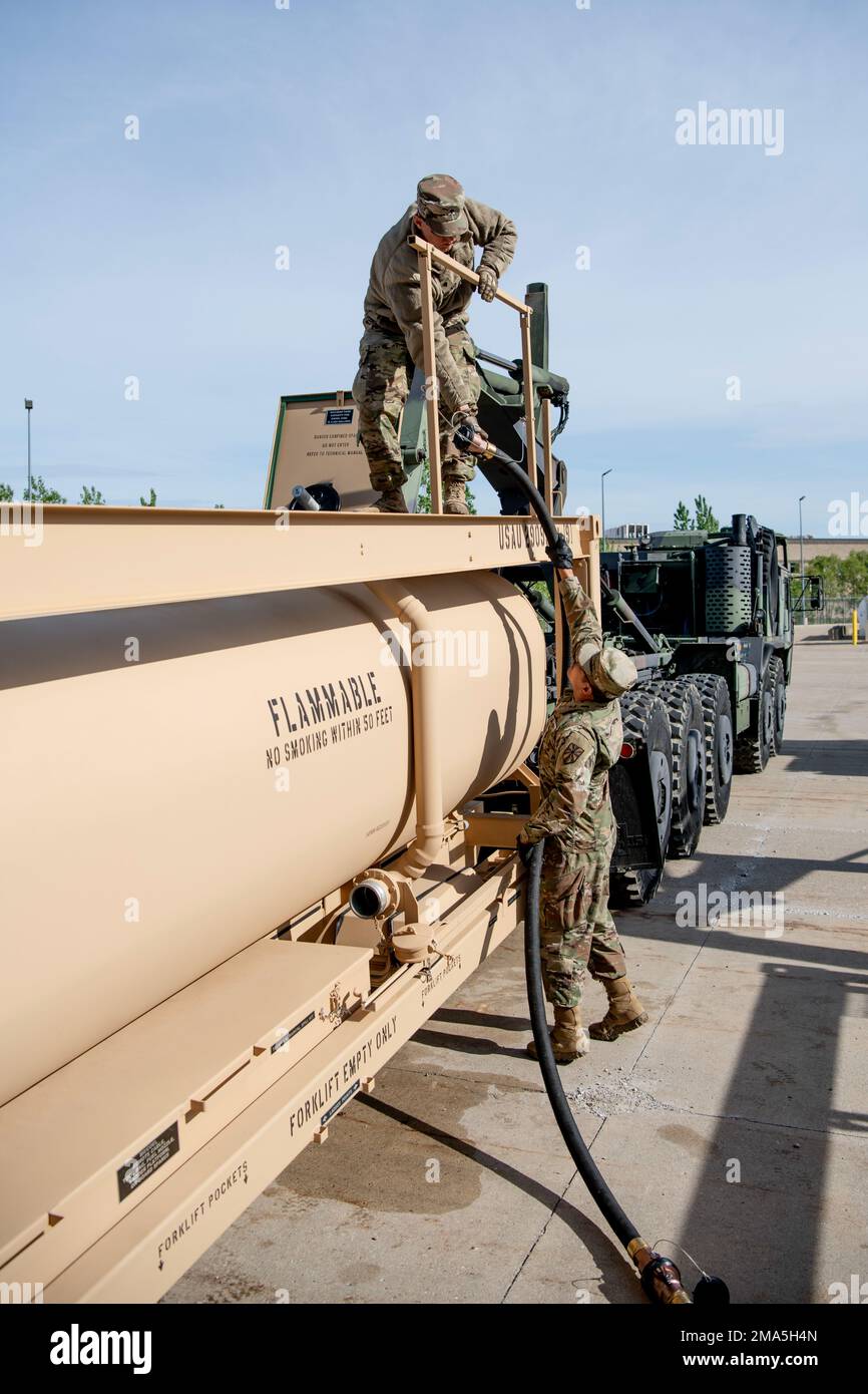 Members of the Michigan National Guard perform a fuel line flushing and ...