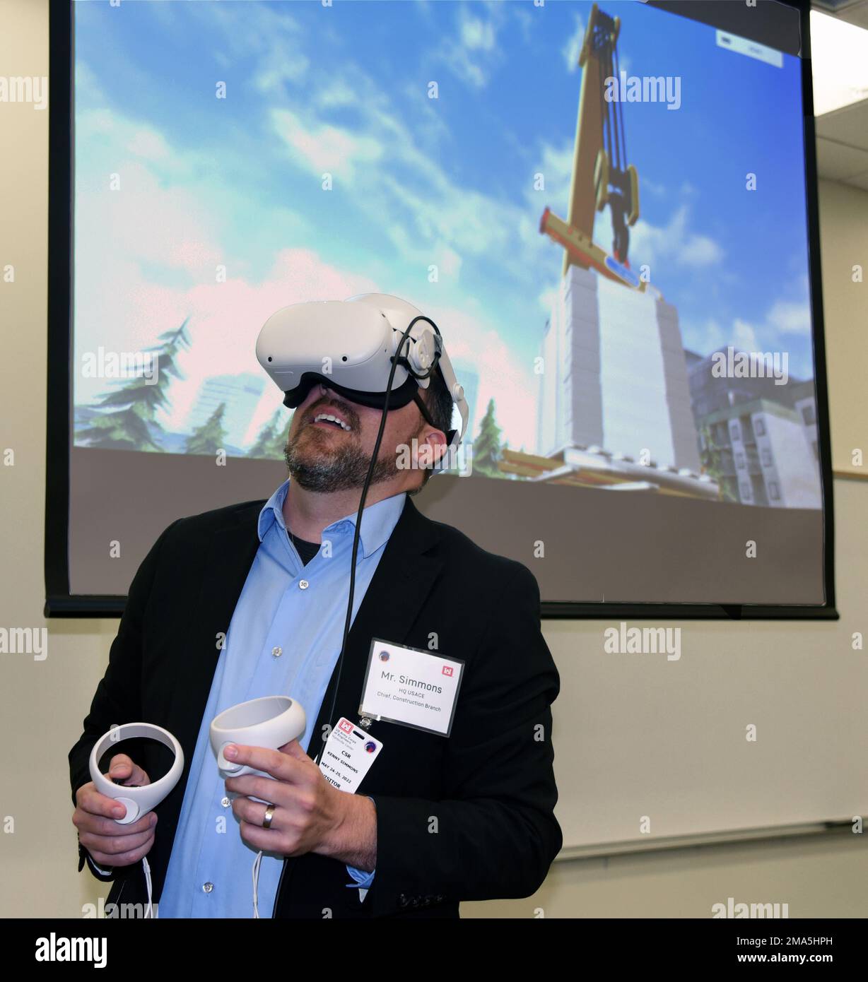 Kenneth SImmons, USACE chief of construction, tries out a demo of a new ...