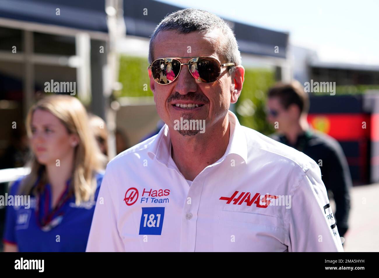 Guenther Steiner, center, Team Principal of Haas F1 Team, walks through ...